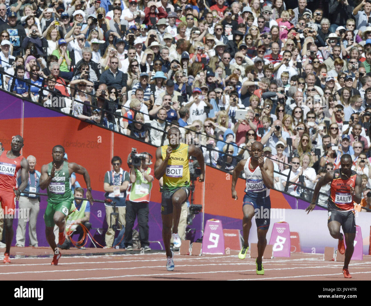 LONDON, Britain - Jamaica's Usain Bolt (C) competes in a men's 100 ...