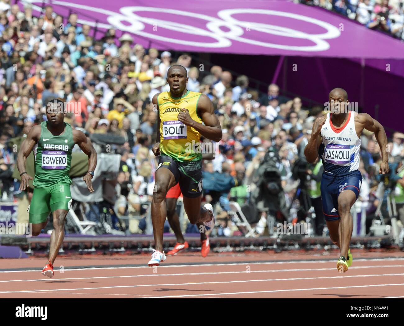 LONDON, Britain -Jamaica's Usain Bolt (C) competes in a men's 100-meter ...