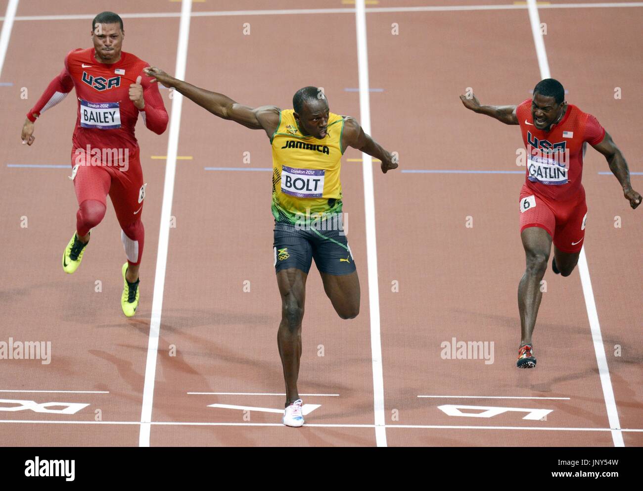 LONDON, Britain - Jamaica's Usain Bolt (C) finishes first in the men's ...