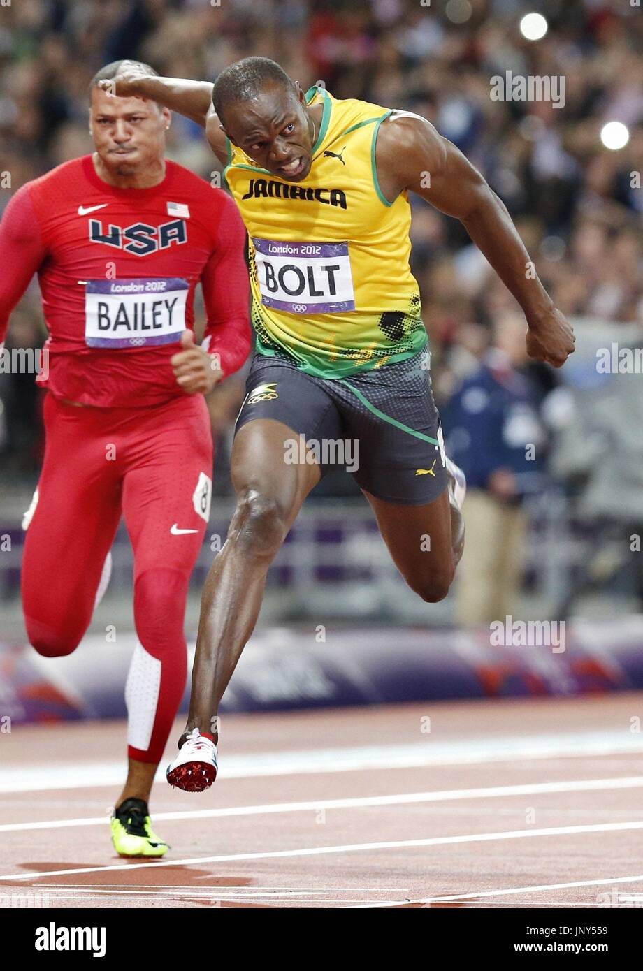 LONDON, Britain - Jamaica's Usain Bolt (R) finishes first in the men's ...