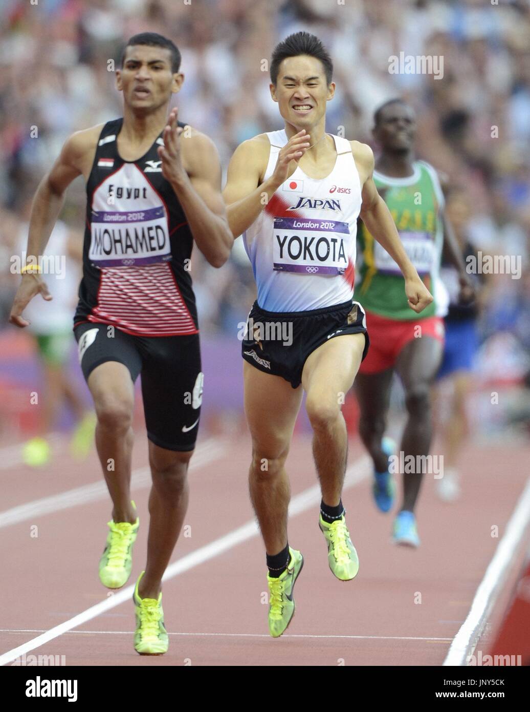 LONDON, Britain - Japan's Masato Yokota (C) runs in the first round of ...