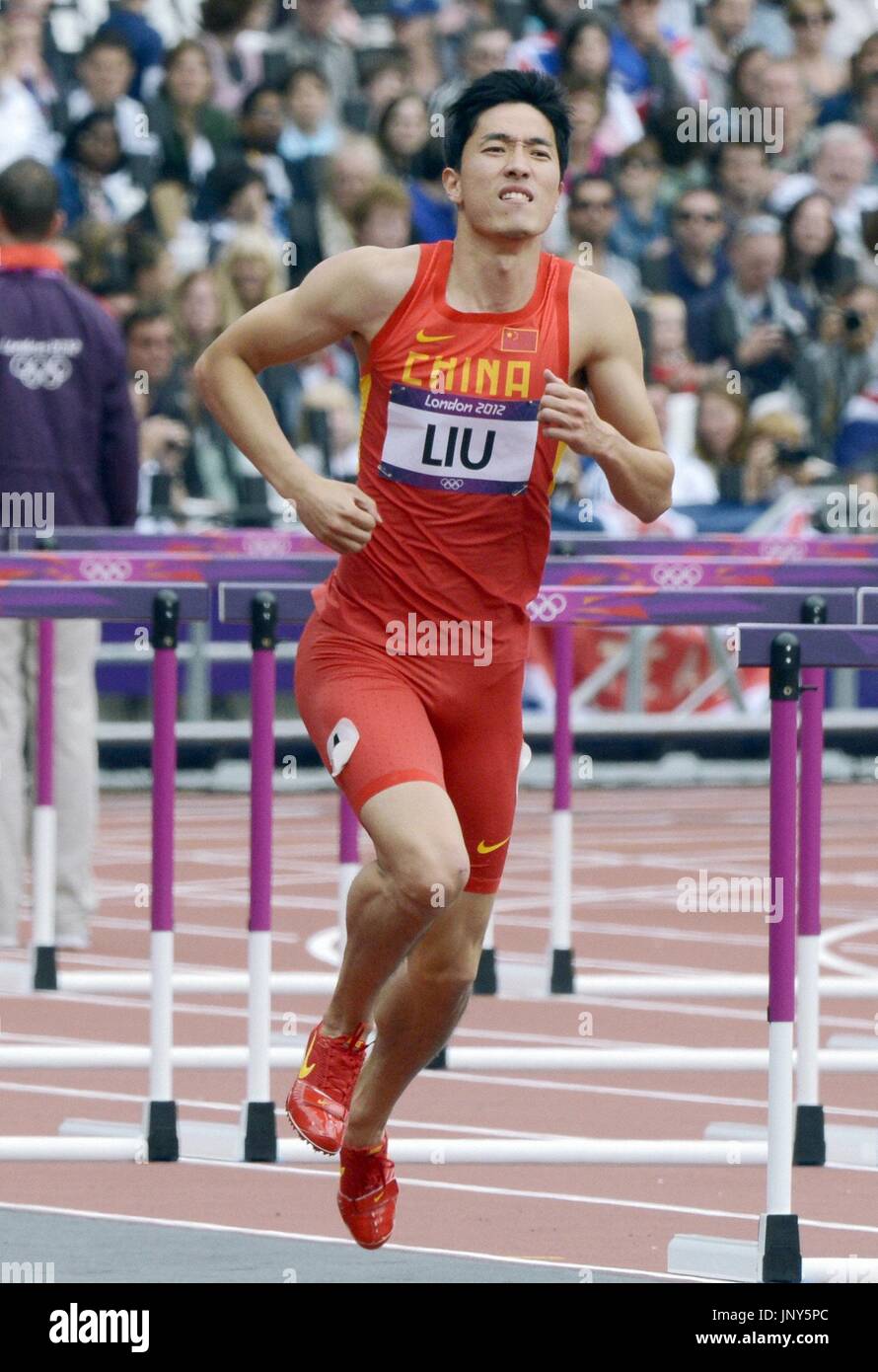 LONDON, Britain - China's Liu Xiang hops on one foot outside his lane ...