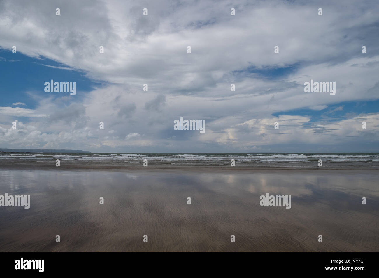 The beautiful summer reflections of Westward Ho Beach in North Devon ...
