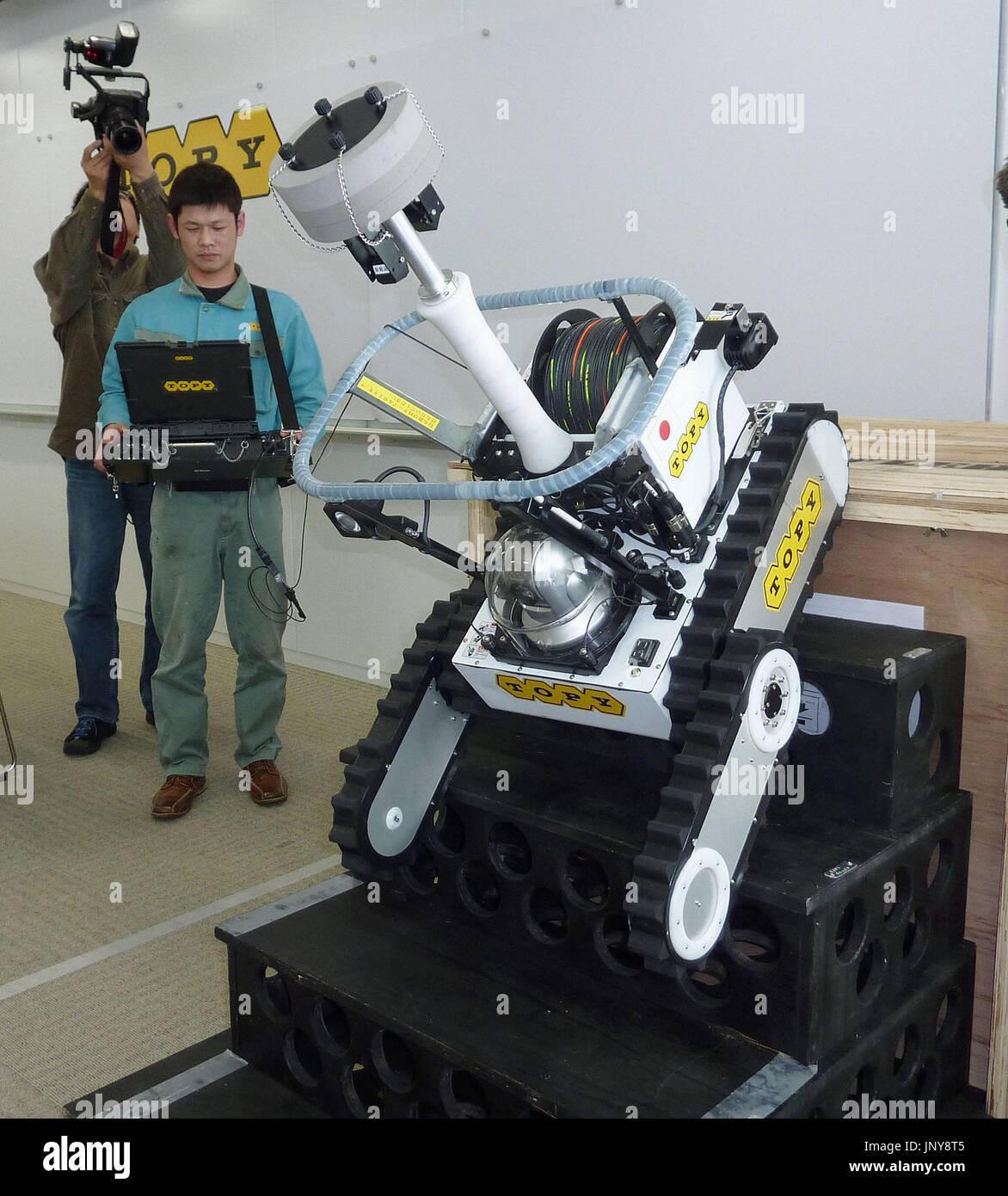TOKYO, Japan - Topy Industries Ltd. unveils a new robot in Tokyo on ...