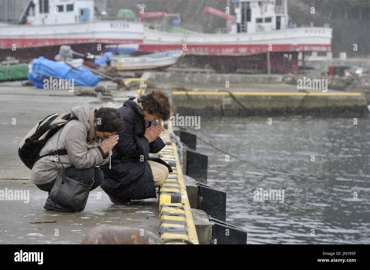 MIYAKO, Japan - Sisters offer prayers at a pier in Miyako, Iwate ...