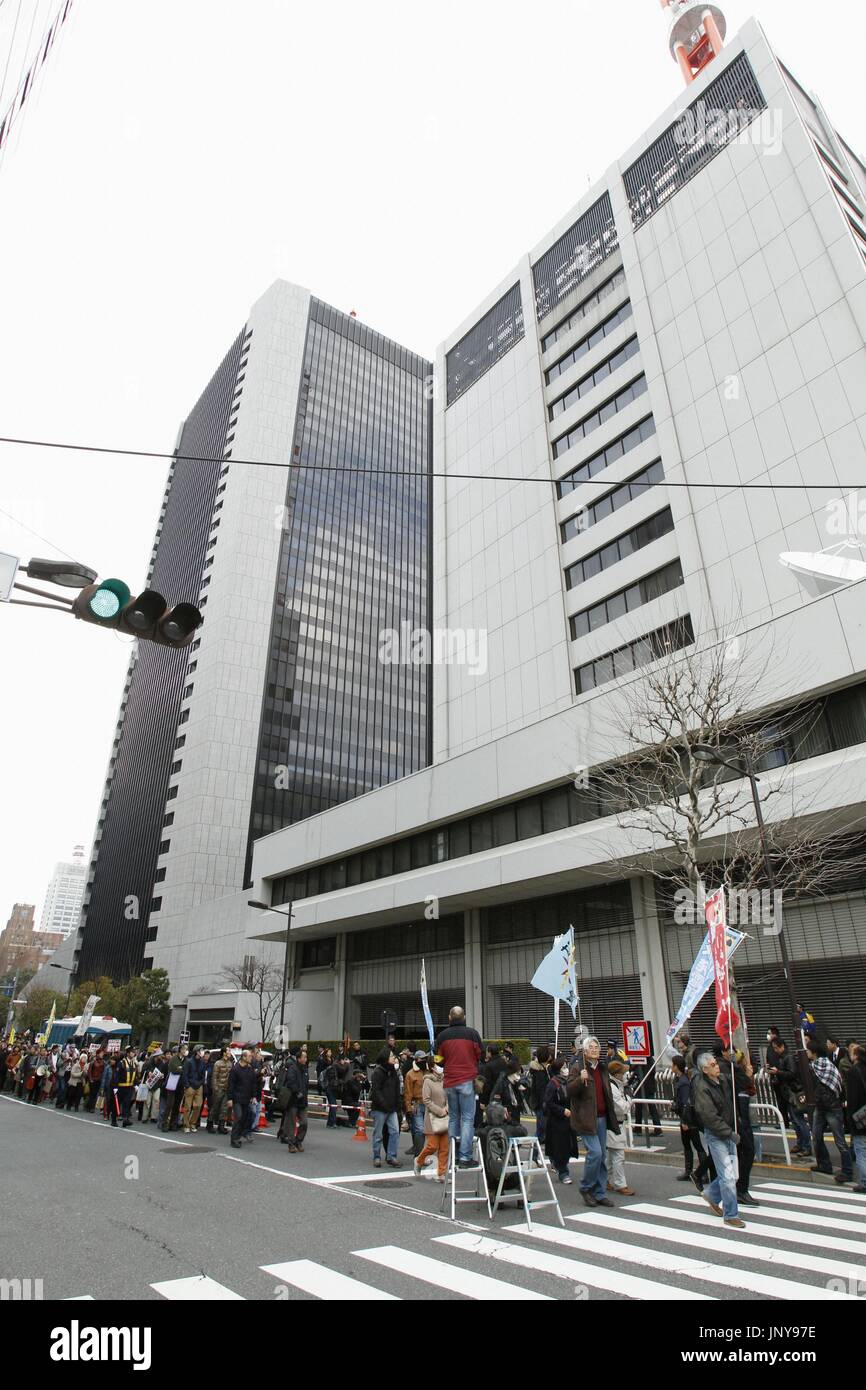 TOKYO, Japan - Antinuclear power demonstrators march outside the head ...