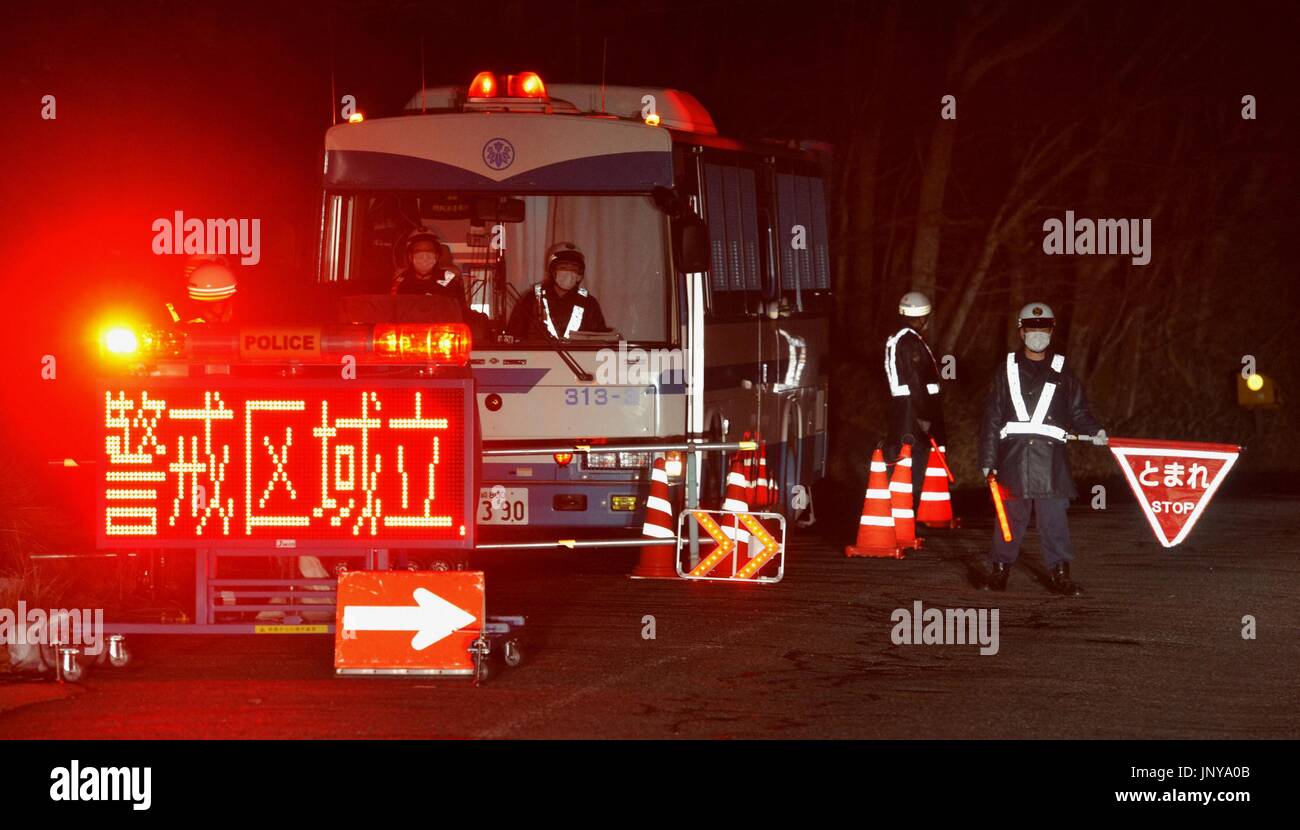 TAMURA, Japan - A new checkpoint is set up on a road in Tamura ...