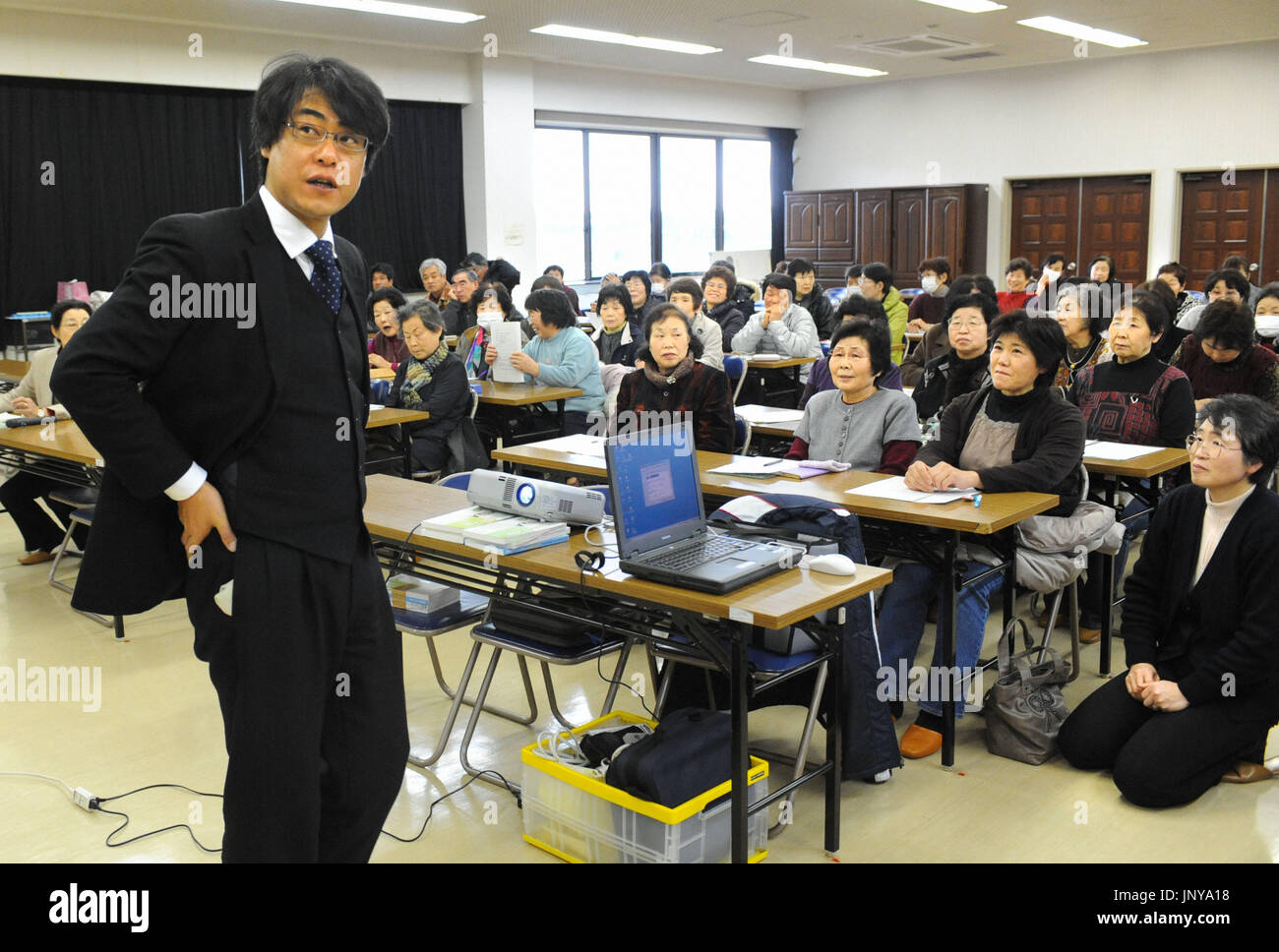 TOKYO, Japan - Shinzo Kimura (L), a radiation hygiene expert, gives a ...