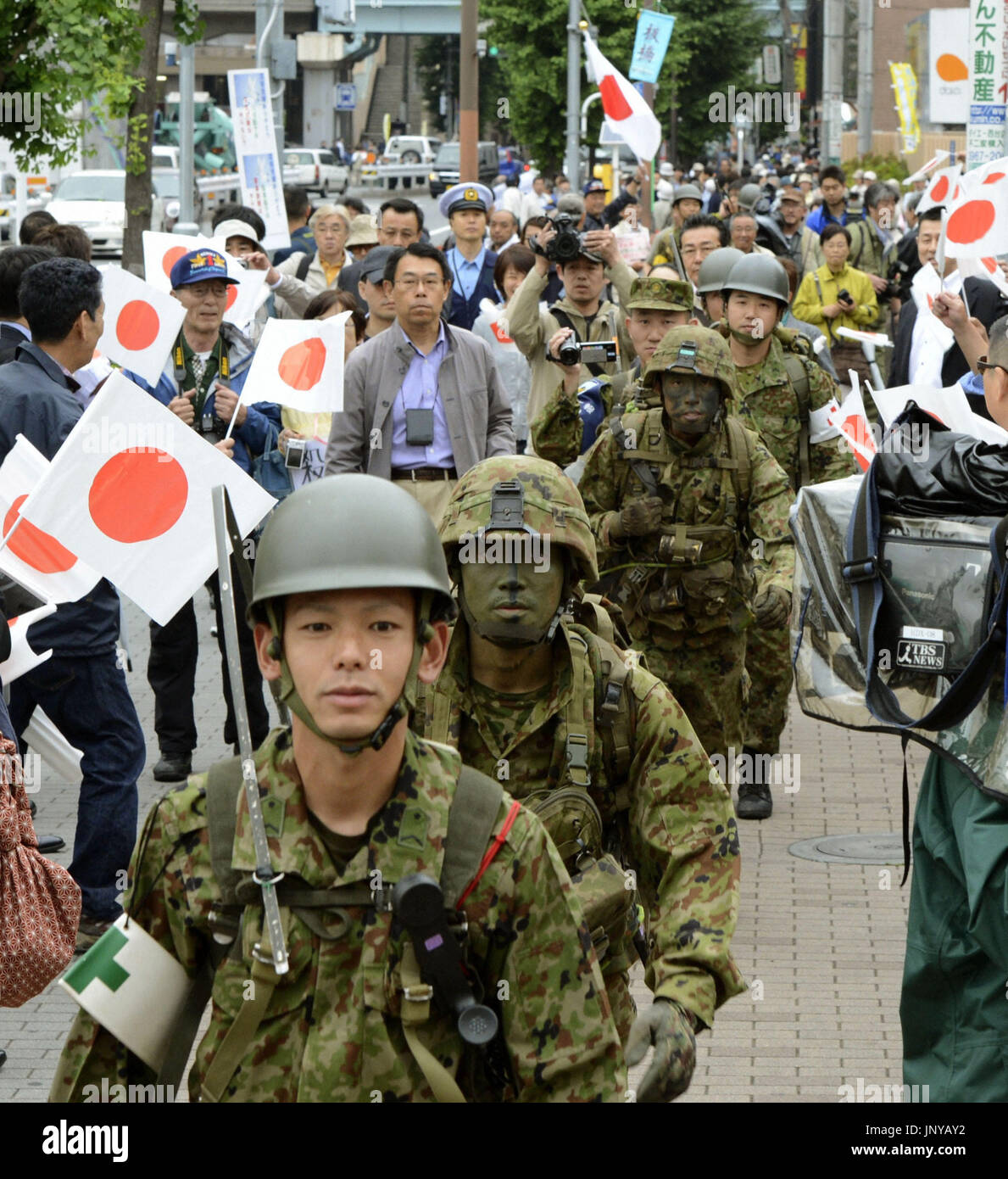 TOKYO, Japan - Rifle-carrying Ground Self-Defense Force troops in ...