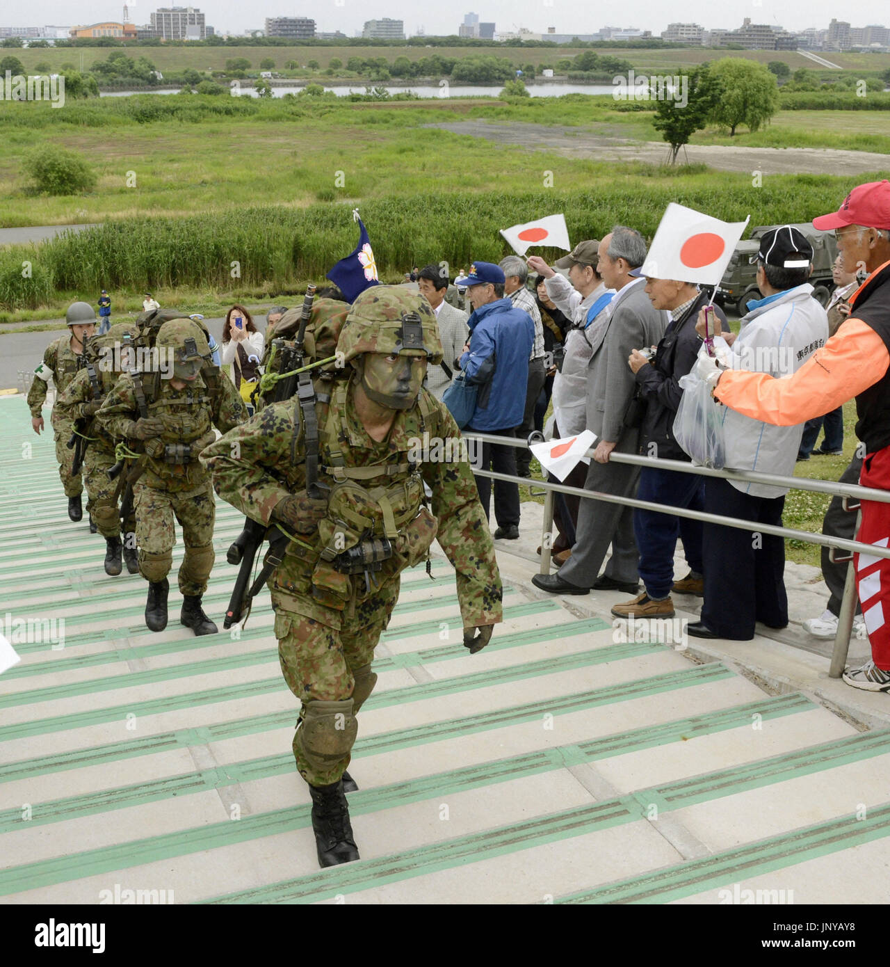 TOKYO, Japan - Rifle-carrying Ground Self-Defense Force troops in ...