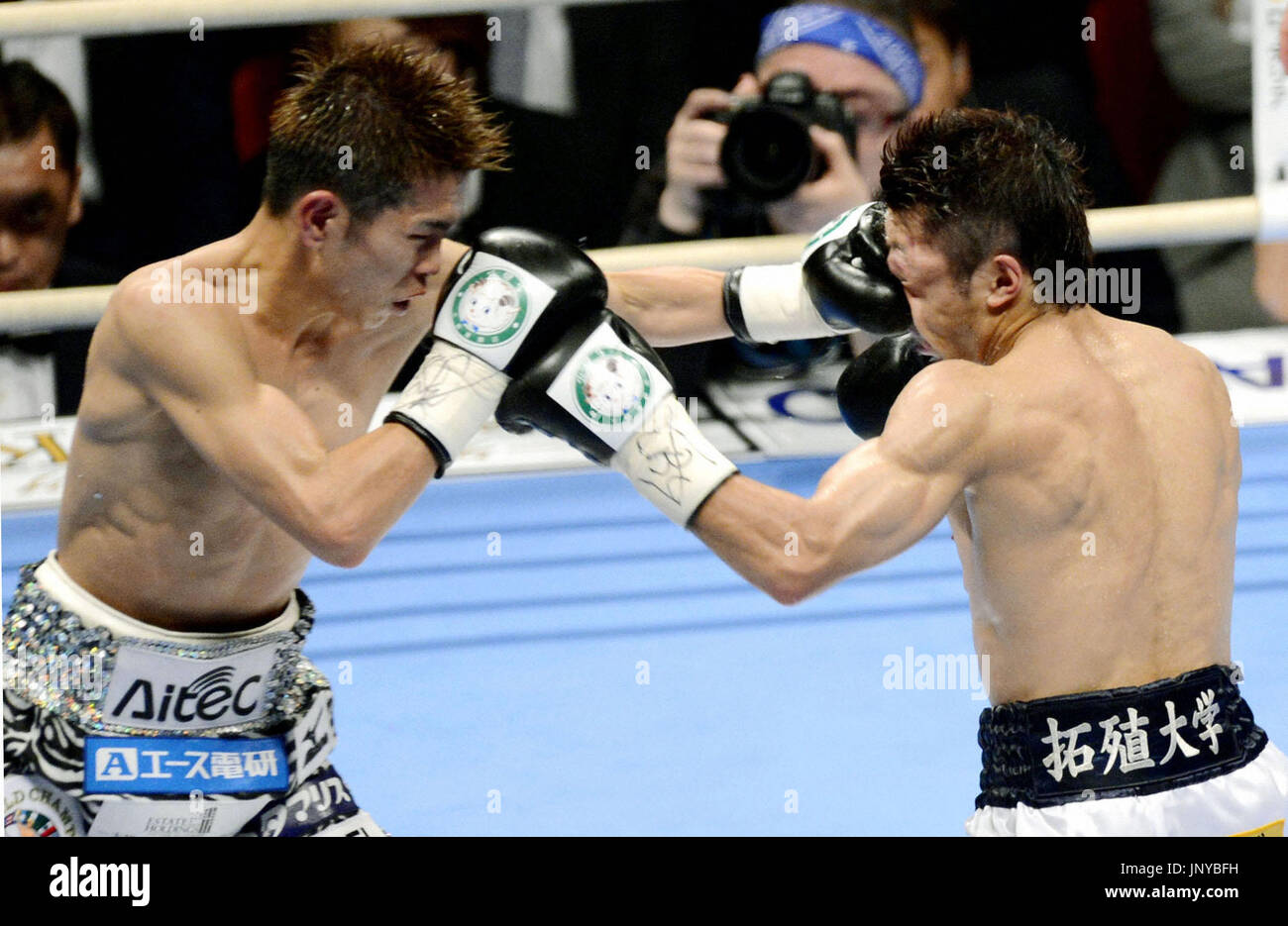 OSAKA, Japan - WBC minimumweight champion Kazuto Ioka (L) hits WBA ...