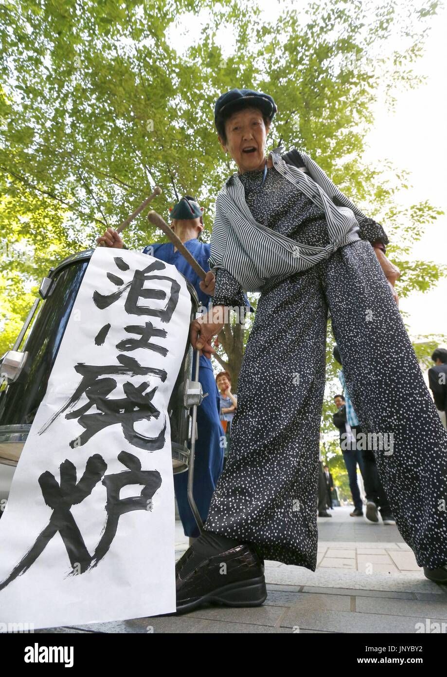 SAPPORO, Japan - People against nuclear power stand in front of the ...
