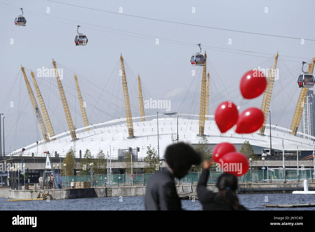 LONDON, Britain - Gondolas transport passengers on a ropeway over the ...