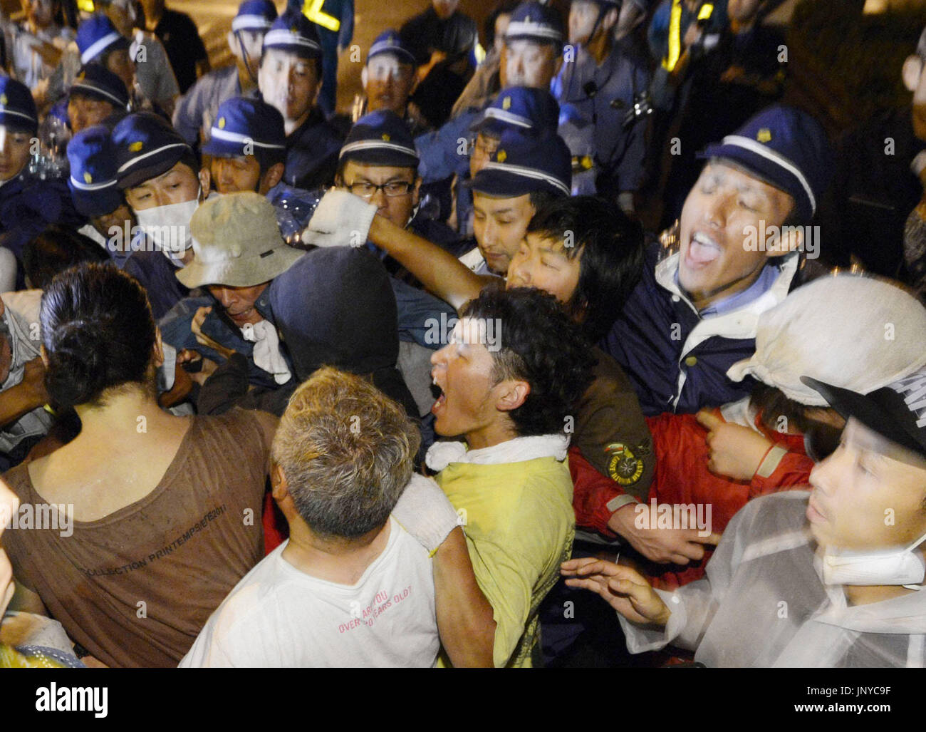 OI, Japan - People confront police around the Oi nuclear power plant in ...