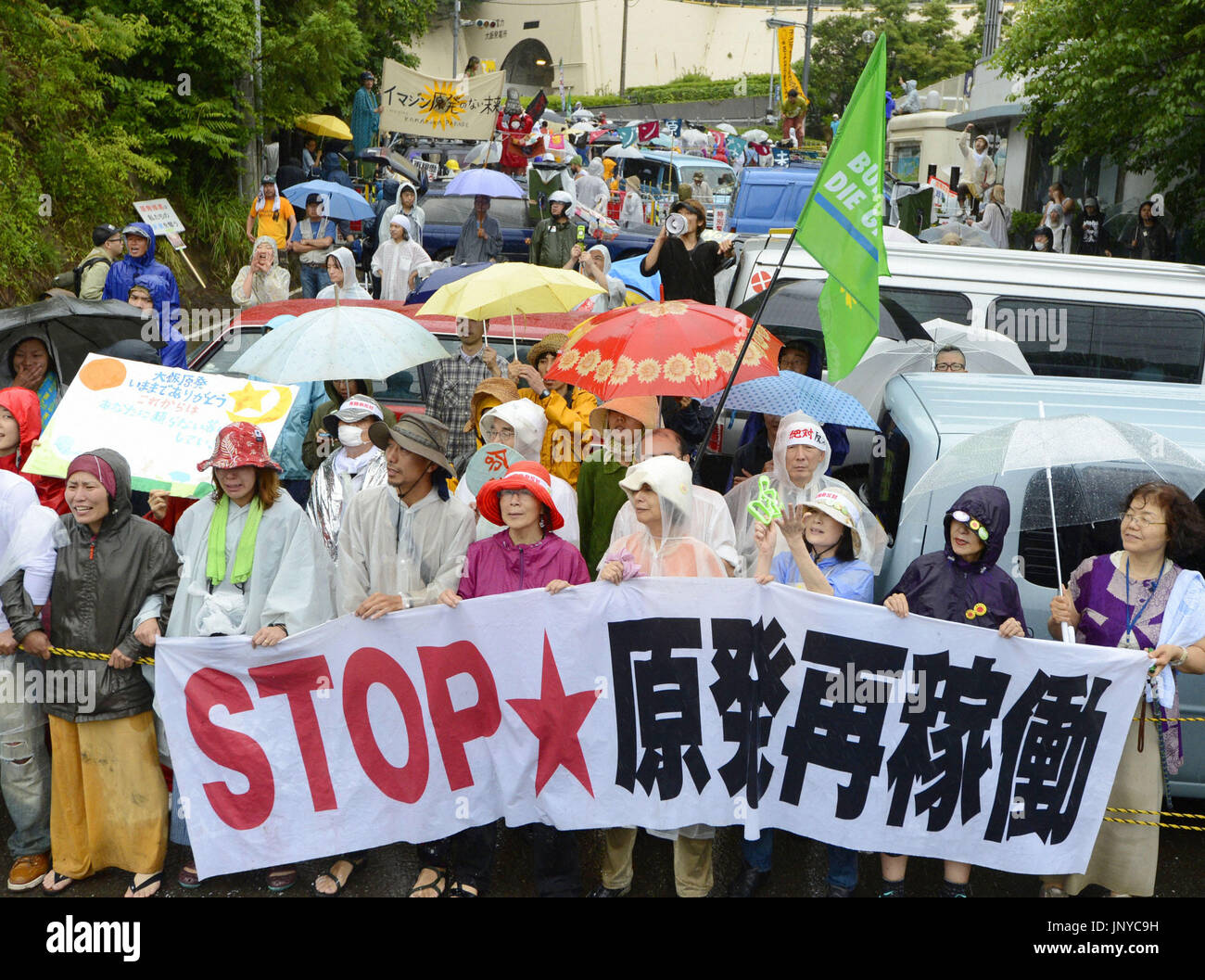 OI, Japan - People block a road leading to the Oi nuclear power plant ...