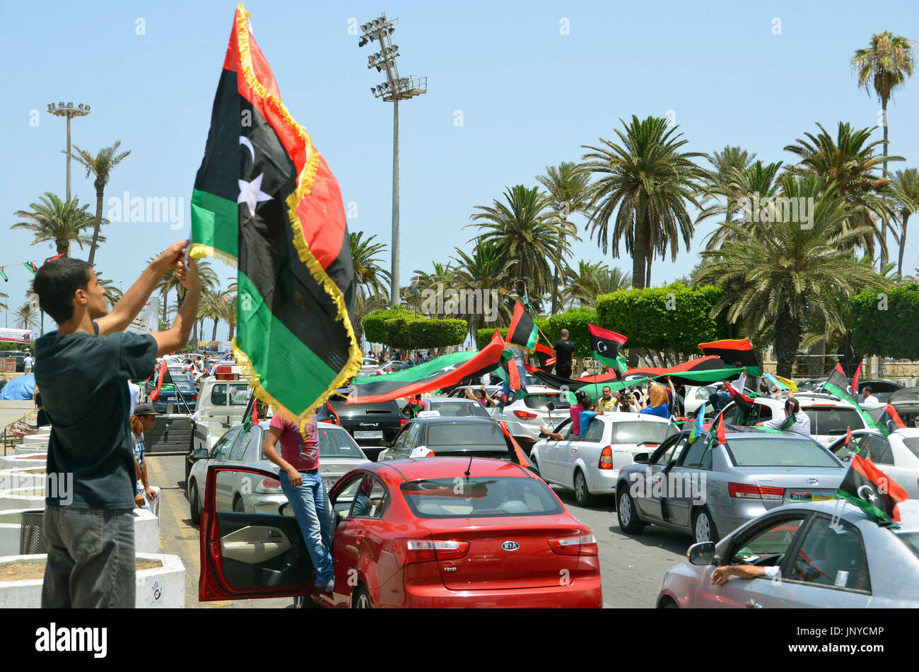 TRIPOLI, Libya - Cars displaying Libyan flags pictured at Tripoli's ...