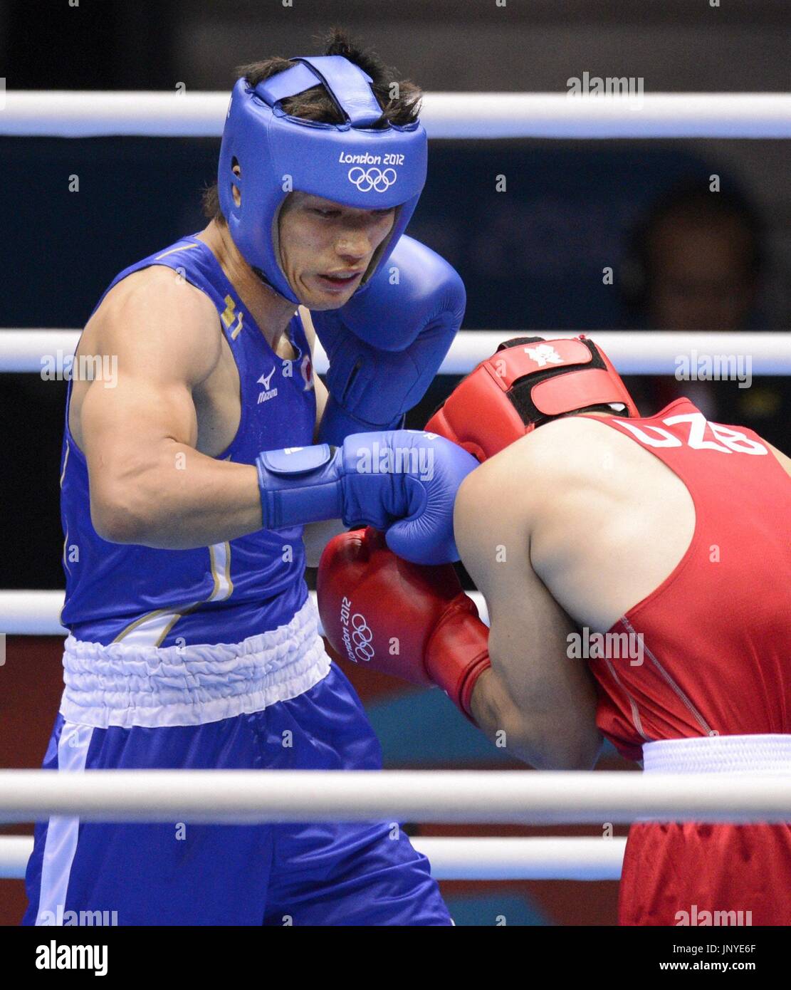 LONDON, Britain - Japan's Ryota Murata (L) fights Uzbekistan's Abbos ...