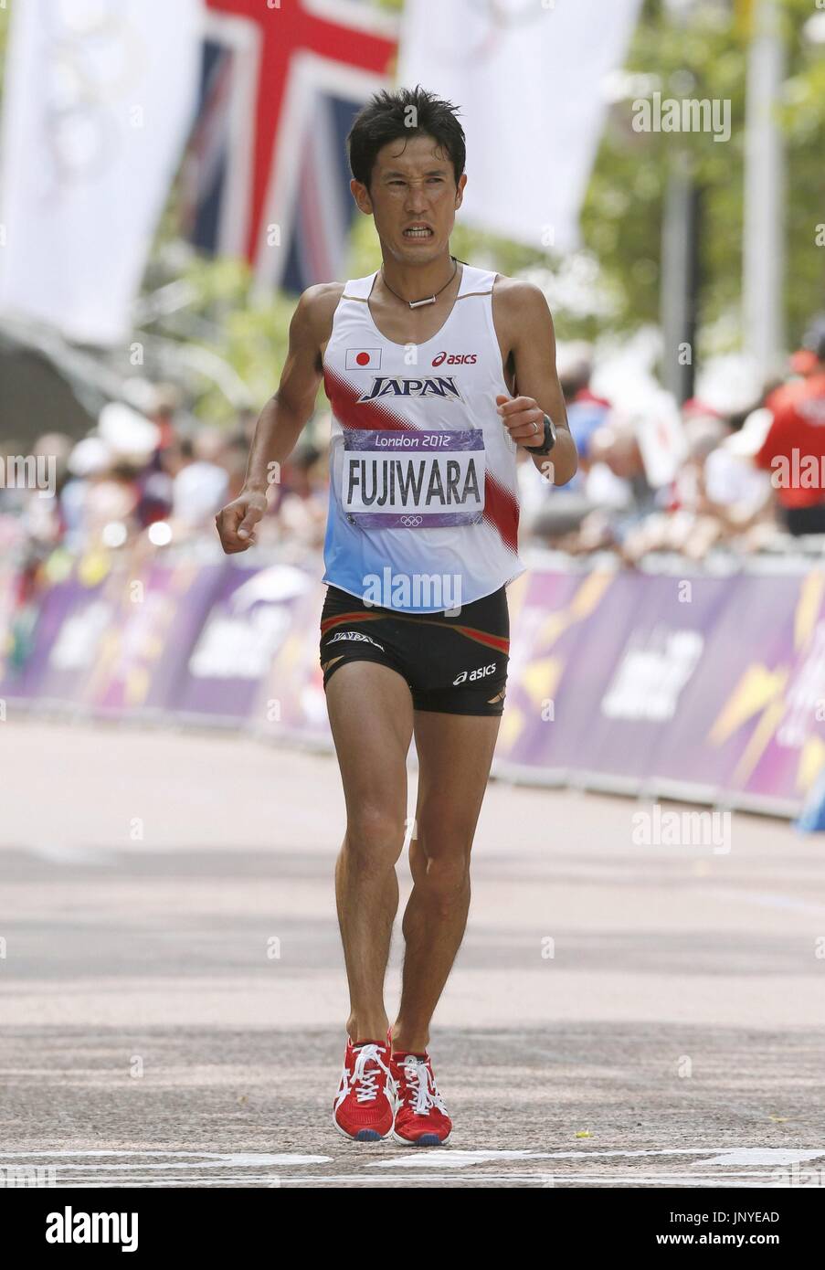 LONDON, Britain - Japan's Arata Fujiwara crosses the finish line in the 2012 London Olympics men ...