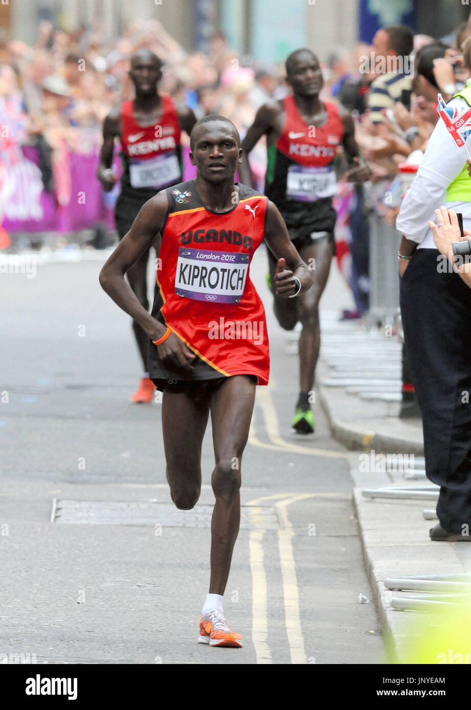 LONDON, Britain - Uganda's Stephen Kiprotich (front) outdistances the runners behind during the ...