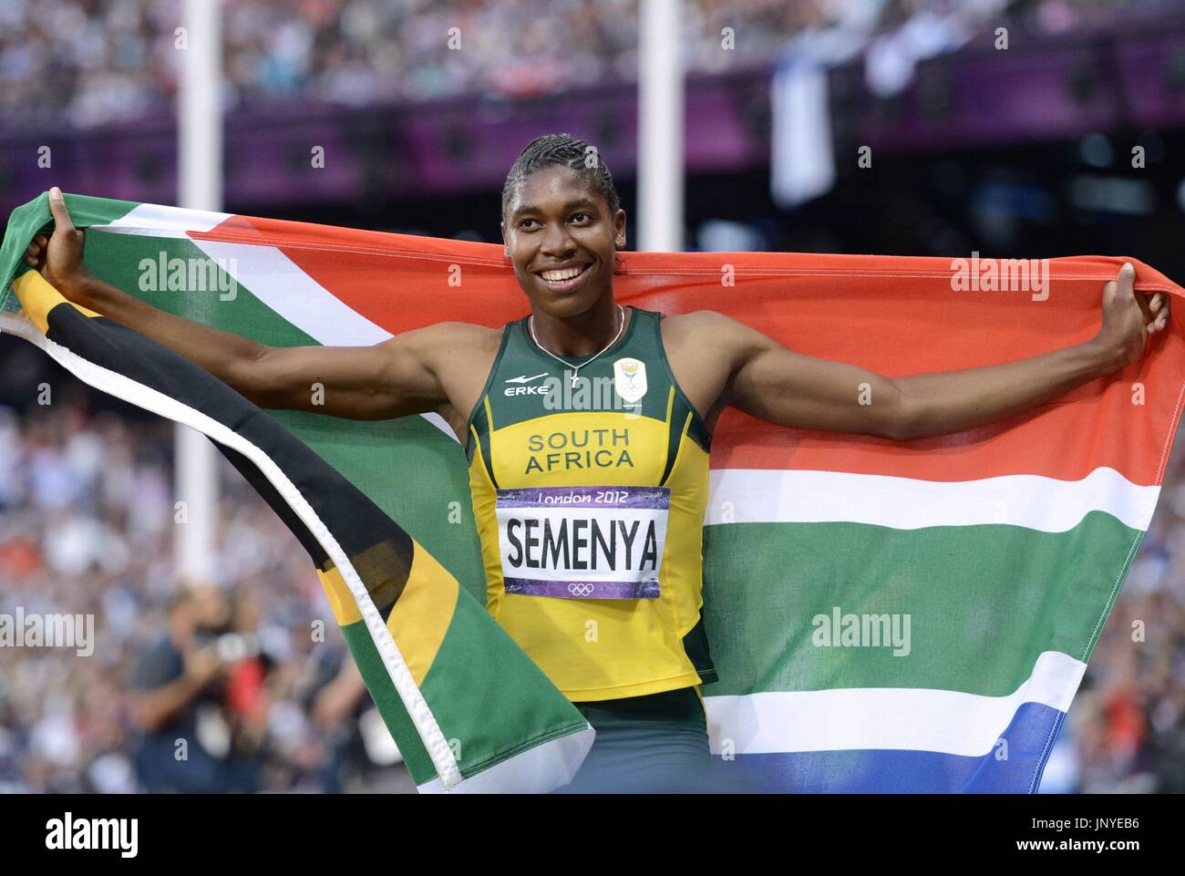 LONDON, Britain - South Africa's Caster Semenya holds her national flag during her victory run ...