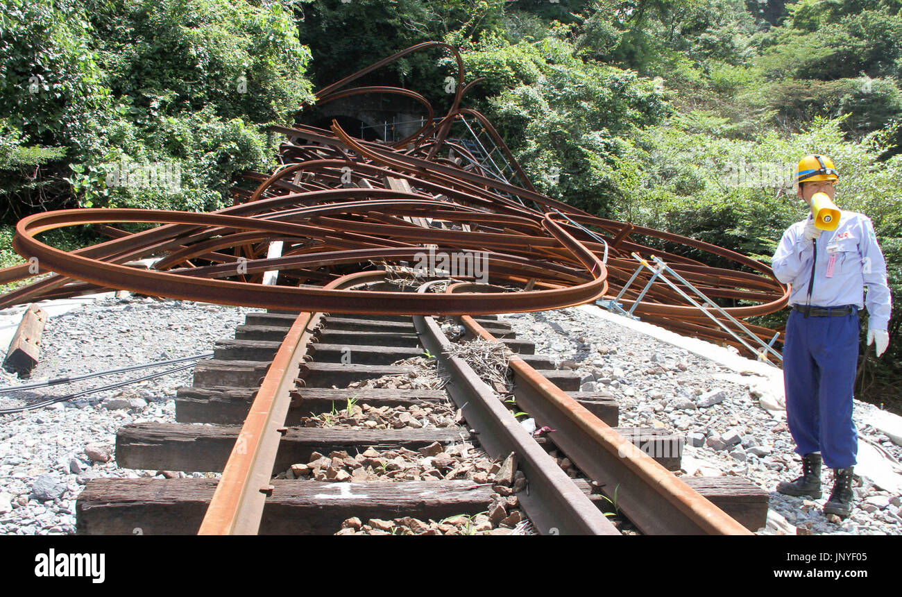 ASO, Japan - Photo taken on Aug. 24, 2012, shows train track wreckage ...