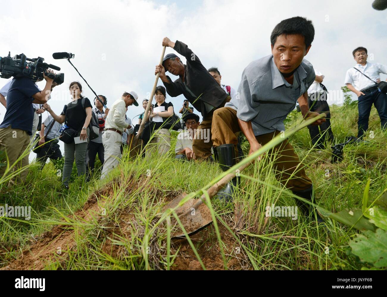 PYONGYANG, North Korea - Men dig at a site on the outskirts of ...