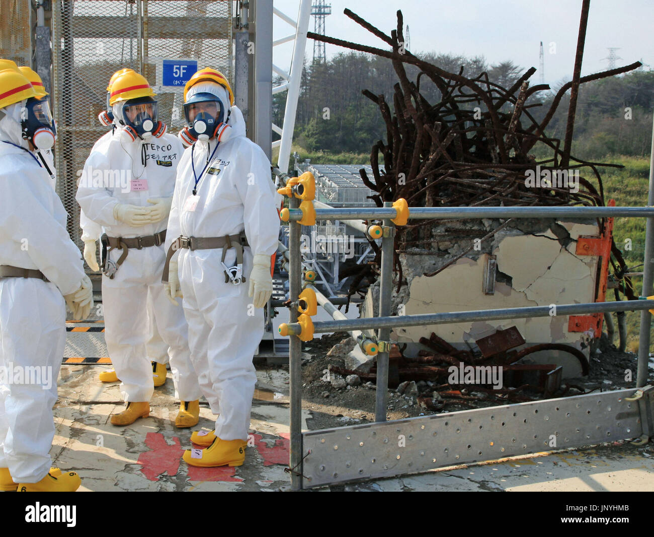 OKUMA, Japan - Japanese Prime Minister Yoshihiko Noda (R), wearing a ...