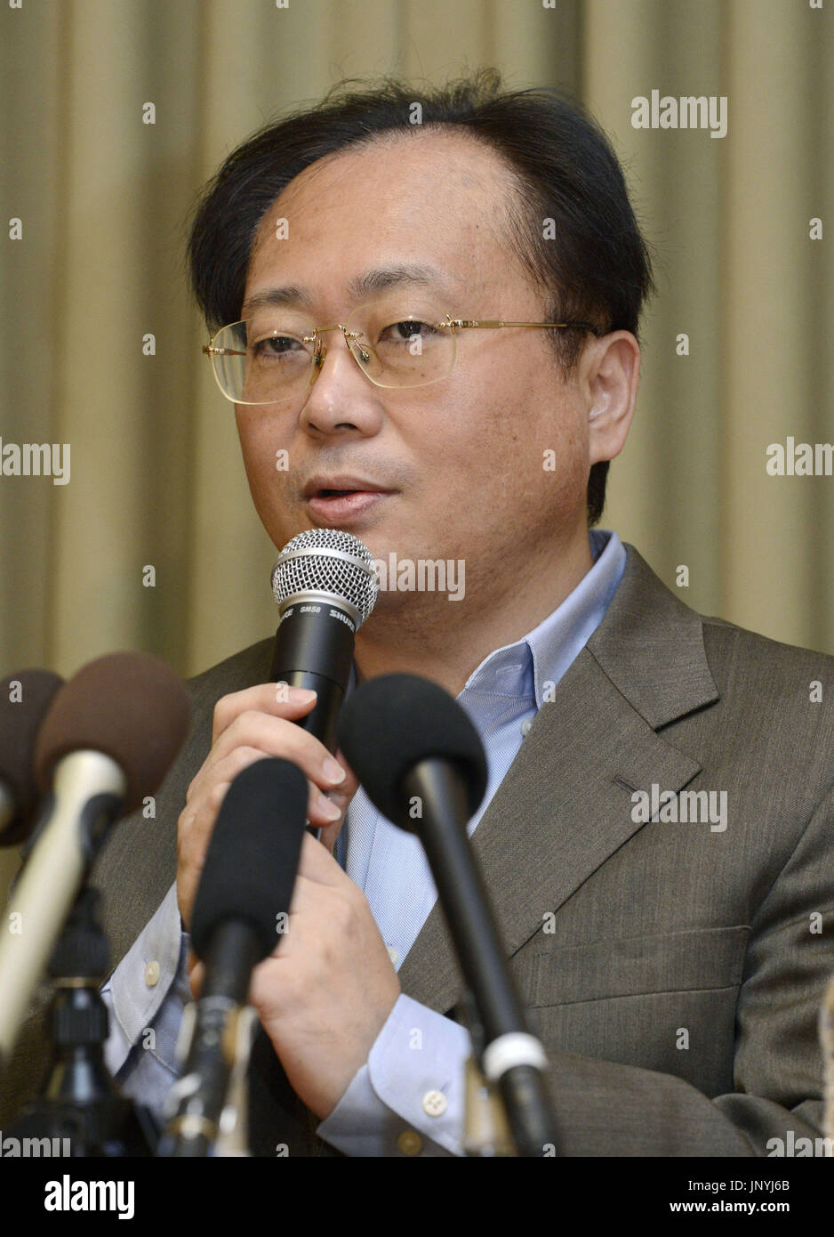 NEW YORK, United States - Japanese researcher Hisashi Moriguchi holds a ...