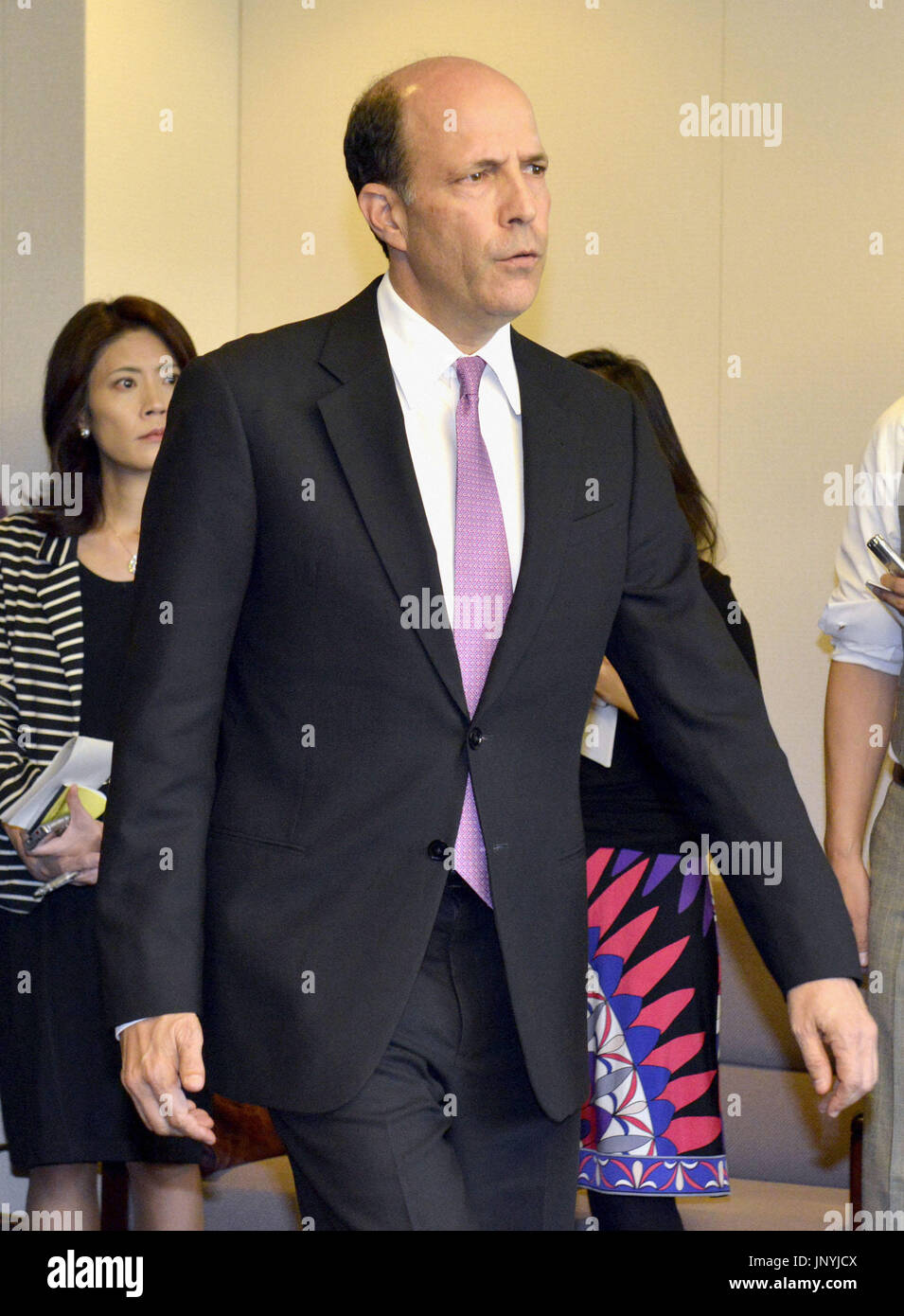 TOKYO, Japan - U.S. Ambassador to Japan John Roos heads to a meeting ...