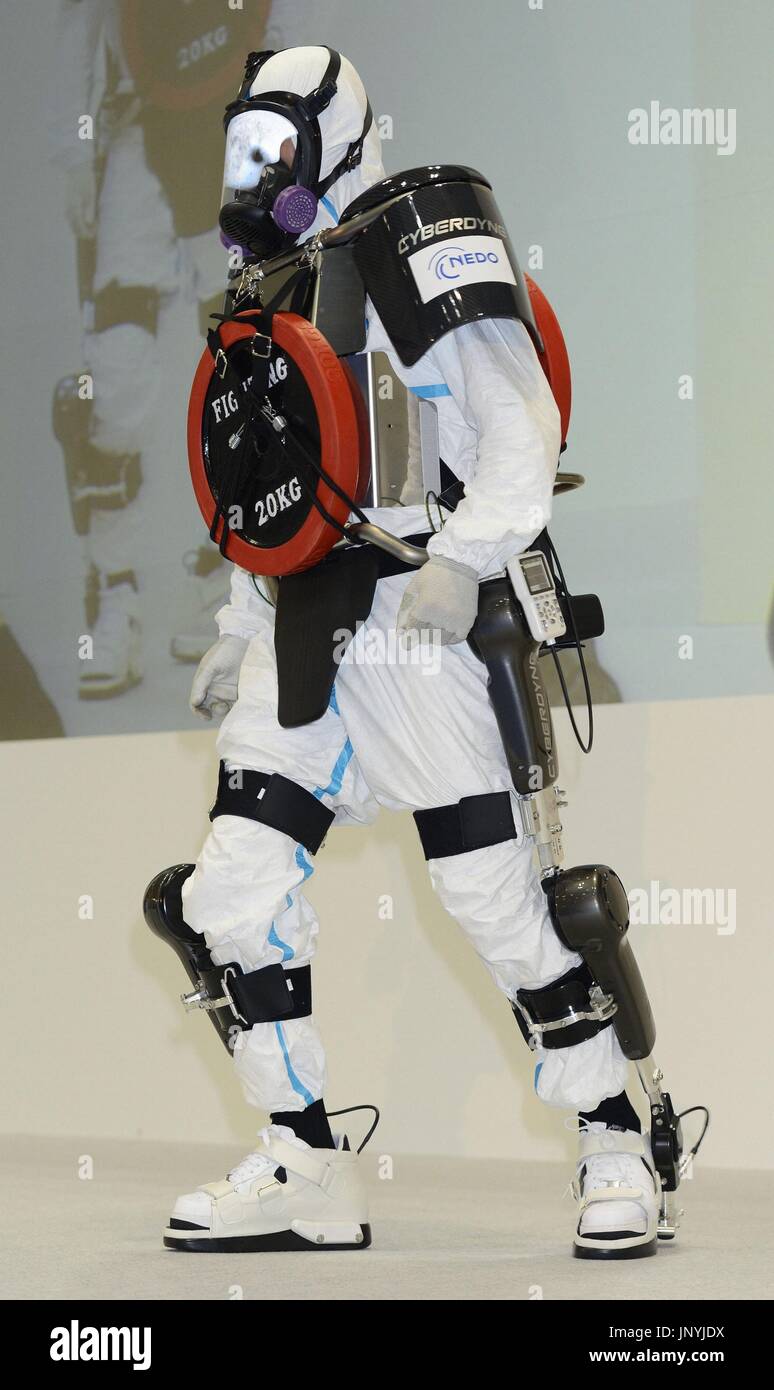 TOKYO, Japan - A person walks wearing a new model of the HAL robotic ...
