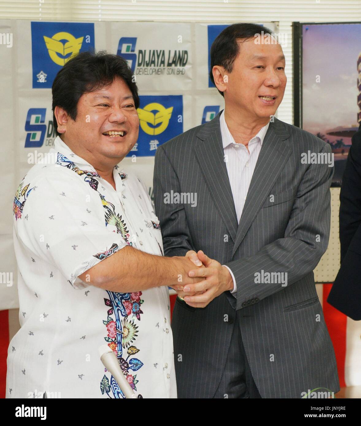 NAHA, Japan - Kin Mayor Tsuyoshi Gibu (L) and Tan Chee Sing, chief ...