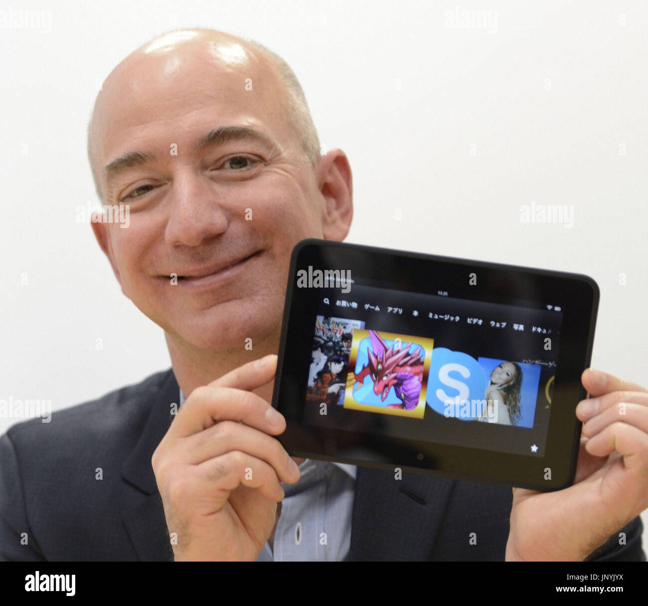 TOKYO, Japan - Amazon.com Inc. chief executive officer Jeff Bezos holds ...