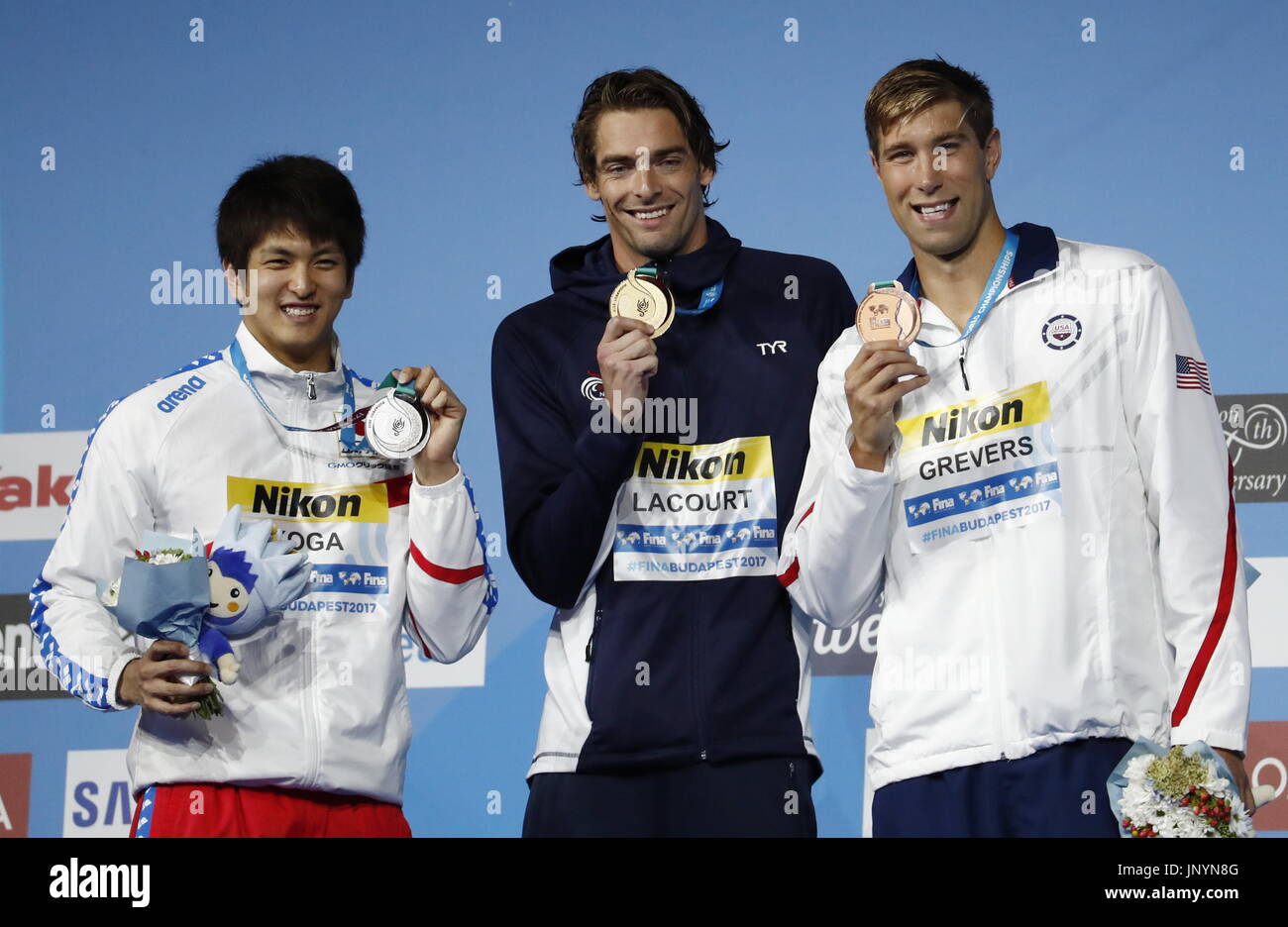 Budapest, Koga Junya (L) of Japan and bronze medalist Matt Grevers of ...