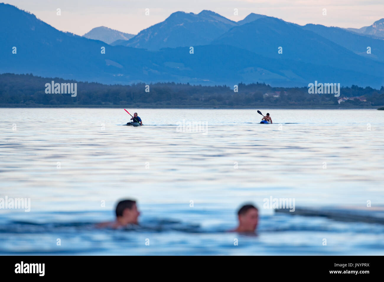 Paddlers can be seen on the Waging Lake during sunset light in Waging ...