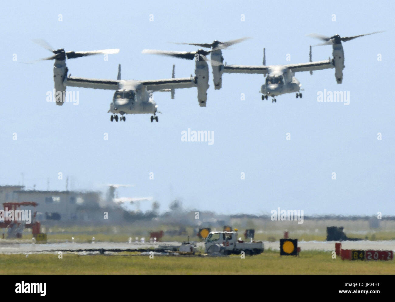 IWAKUNI, Japan - Two of the U.S. Marine Corps' Osprey military aircraft ...