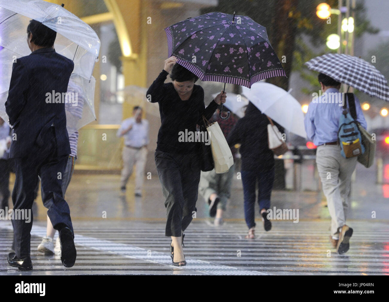 NAGOYA, Japan - People walk in Nagoya's Nakamura Ward on Sept. 30, 2012 ...