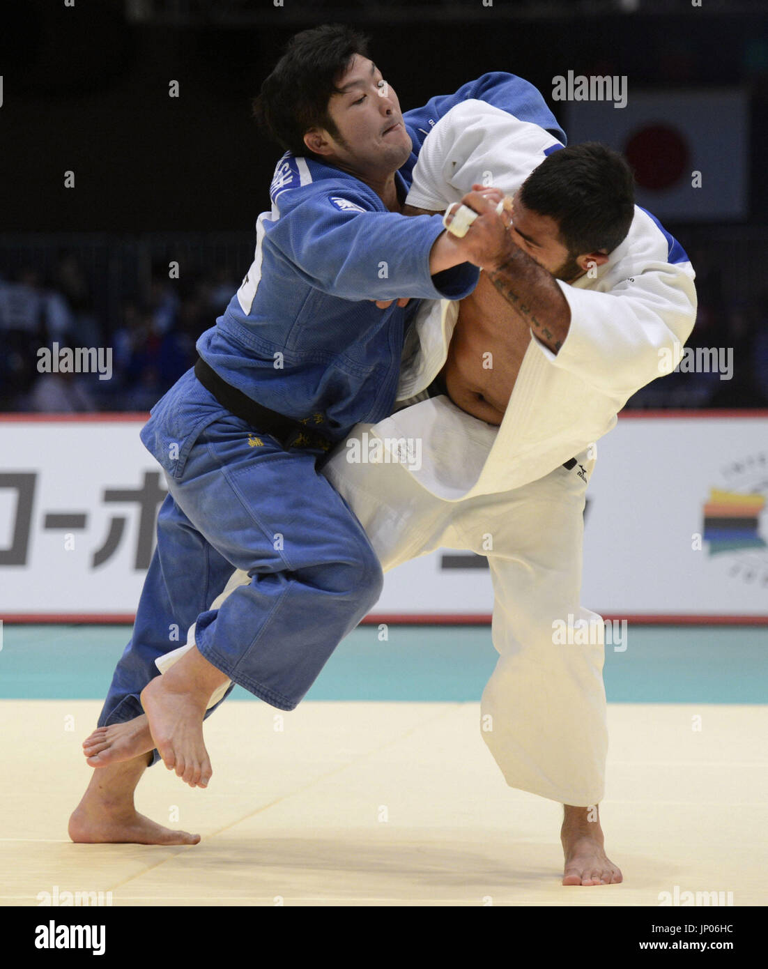 TOKYO, Japan - Japan's Daisuke Kobayashi (L) defeats Ilias Iliadis of Greece to win the men's ...