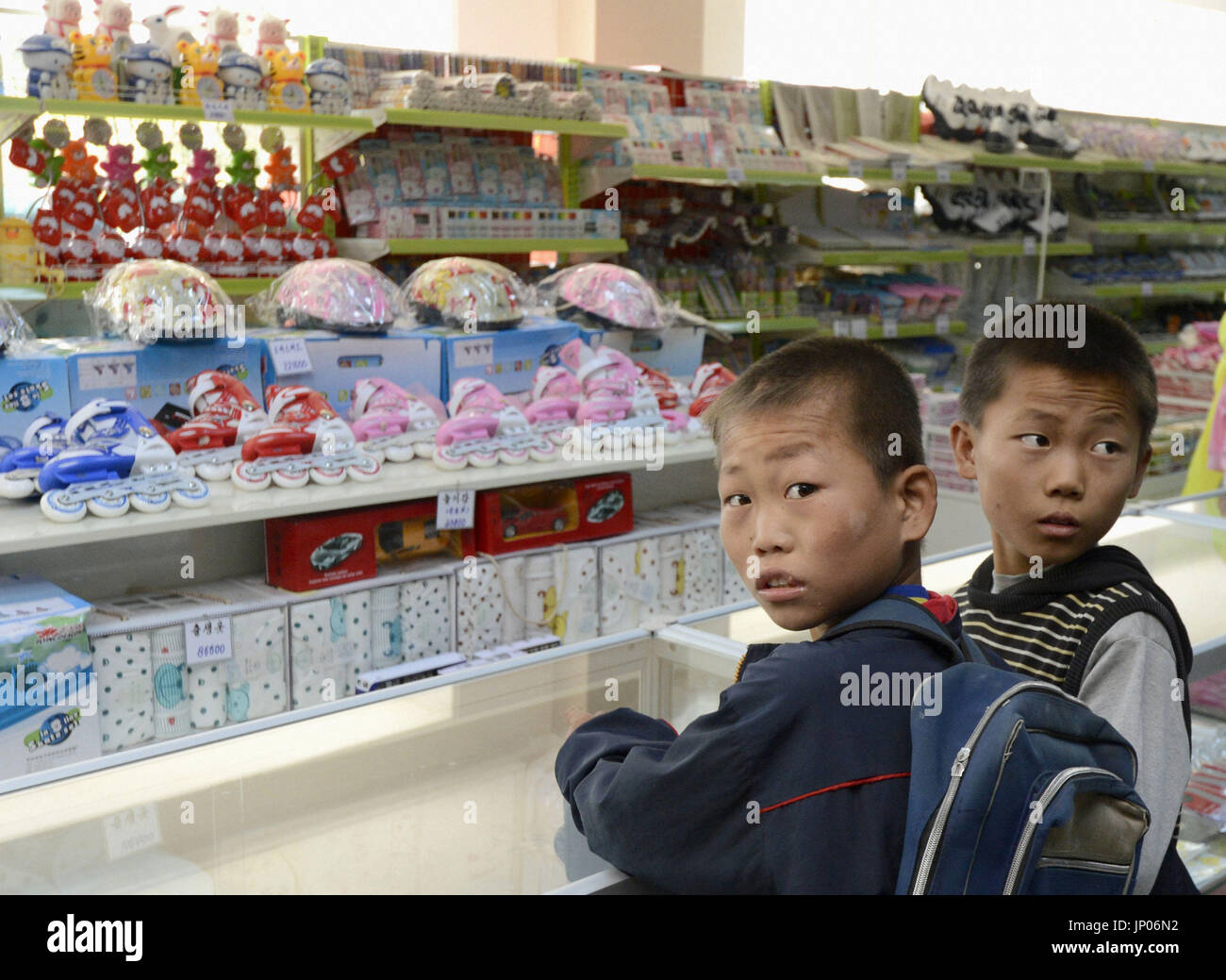 PYONGYANG, North Korea - Boys stand at a skating goods section in a ...