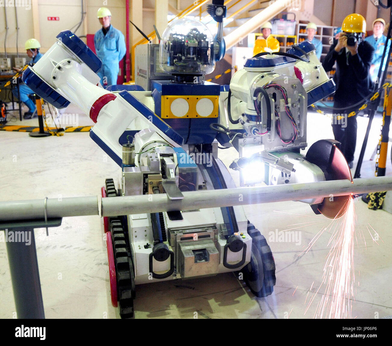 OSAKA, Japan - Photo shows MHI-MEISTeR robot cutting off a pipe during ...