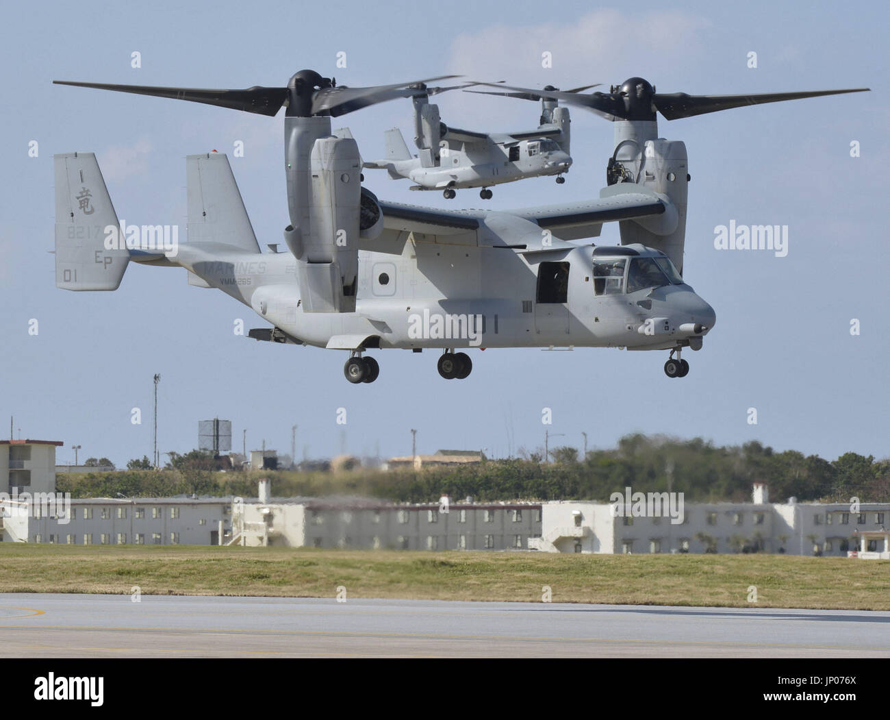 GINOWAN, Japan - An Osprey tilt-rotor transport aircraft lands at the ...