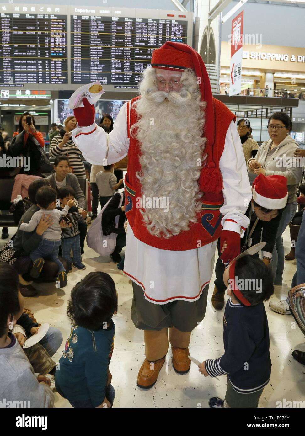 NARITA, Japan - Santa Claus greets children upon arriving at Narita ...