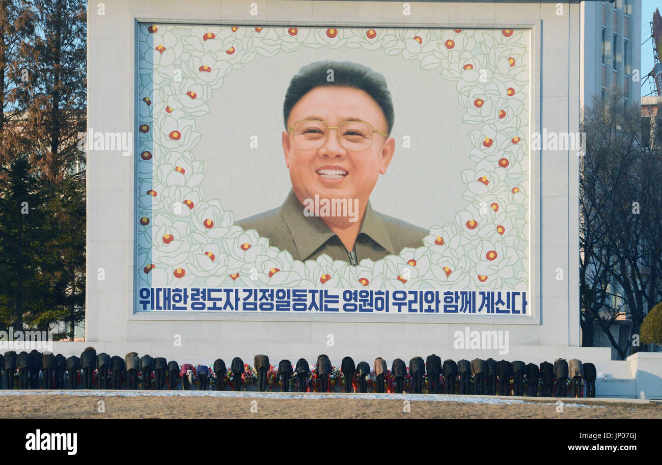 PYONGYANG, North Korea - People lower their heads before the portrait ...