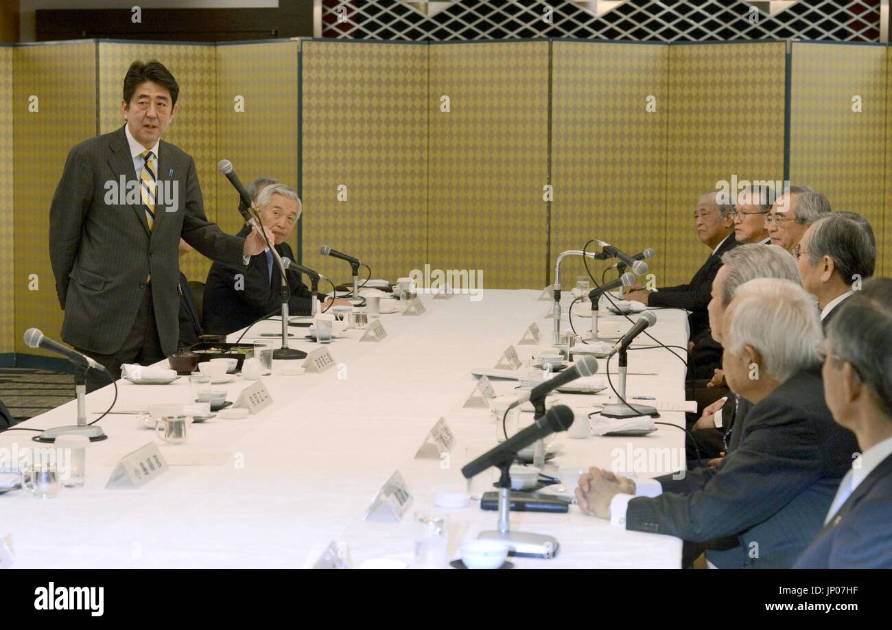 TOKYO, Japan - Liberal Democratic Party President Shinzo Abe (far L ...