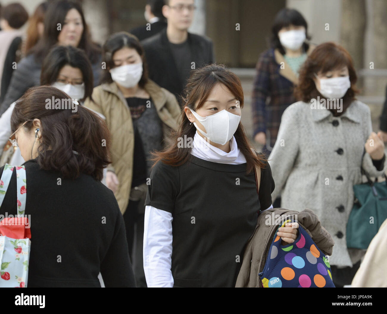 FUKUOKA, Japan - Photo shows women wearing masks in a downtown area in ...