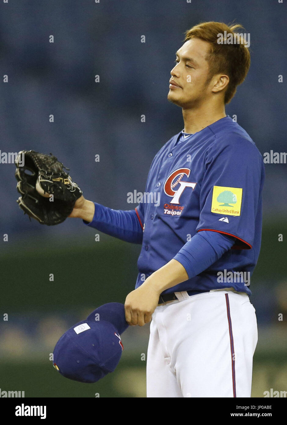 TOKYO, Japan - Taiwan pitcher Yang Yao-hsun reacts after Yasmany Tomas ...