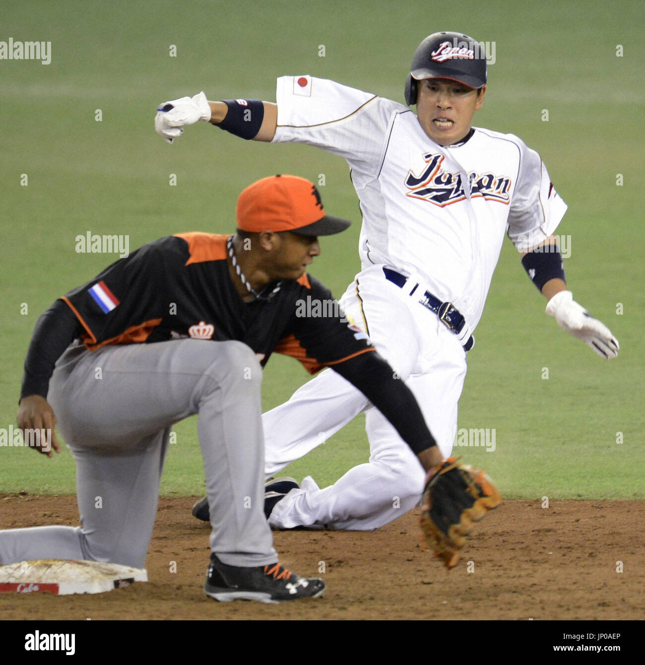 TOKYO, Japan - Katsuya Kakunaka of Japan steals second base past second ...