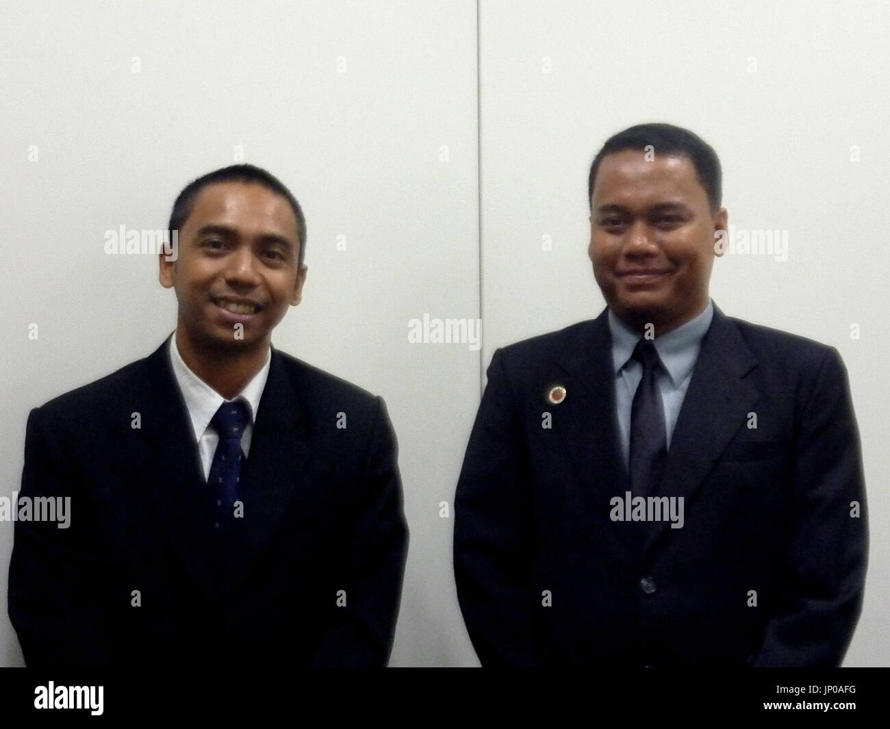 TOKYO, Japan - Yuli Martunis (L) and Hafriza, trainees from Banda Aceh ...