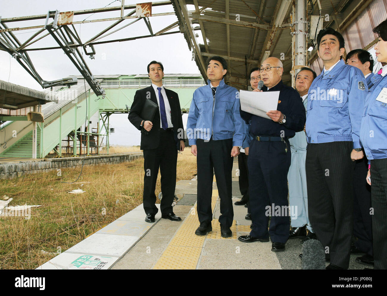 TOMIOKA, Japan - Prime Minister Shinzo Abe (front, 2nd from R) listens as Katsuya Endo (front ...
