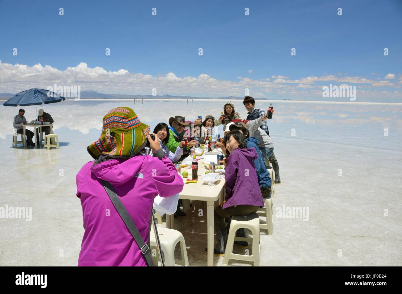 UYUNI, Bolivia - Photo shows Japanese tourists dining on the Uyuni salt ...