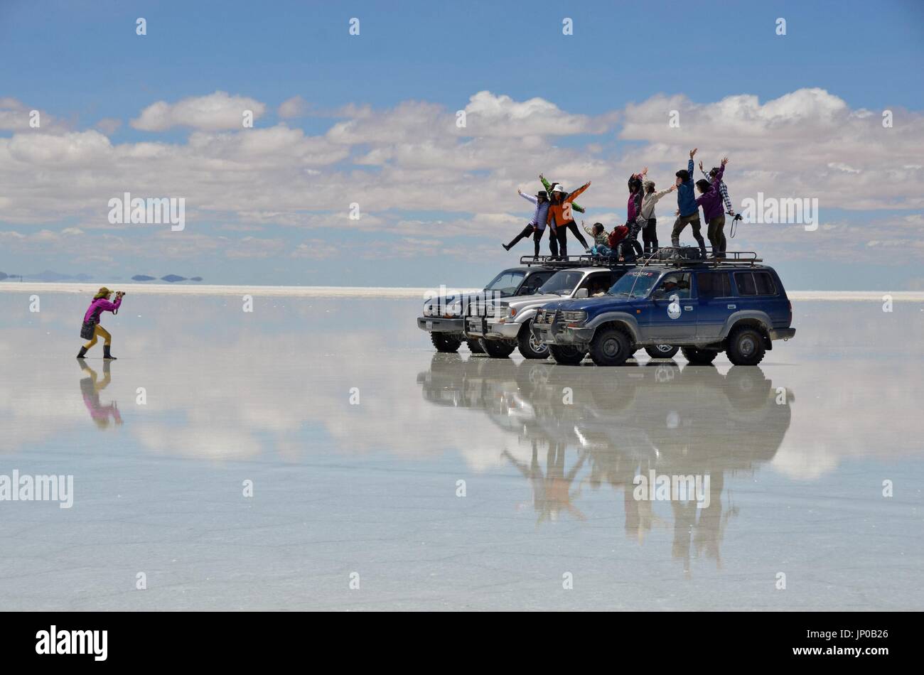 UYUNI, Bolivia - Photo shows Japanese tourists posing for photos on the ...